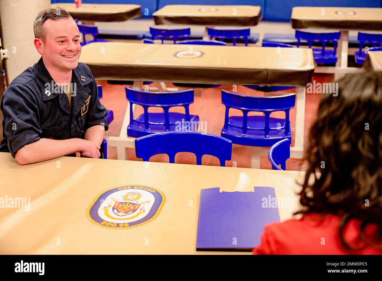 U.S. Navy Lt. John Gwin, left, an integrated air and missile defense ...