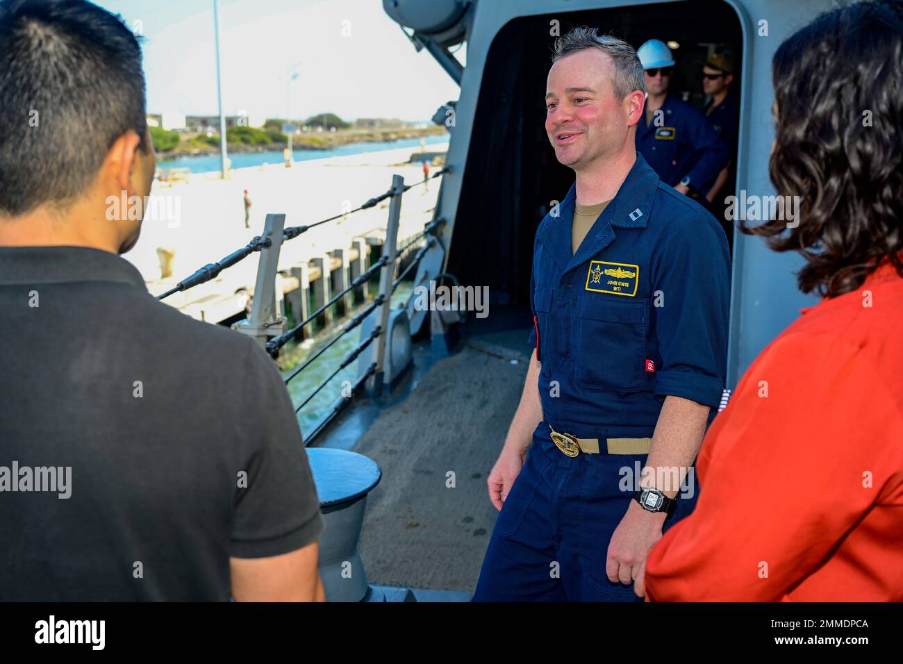 A training and data analytics team meet on the quarterdeck of the ...