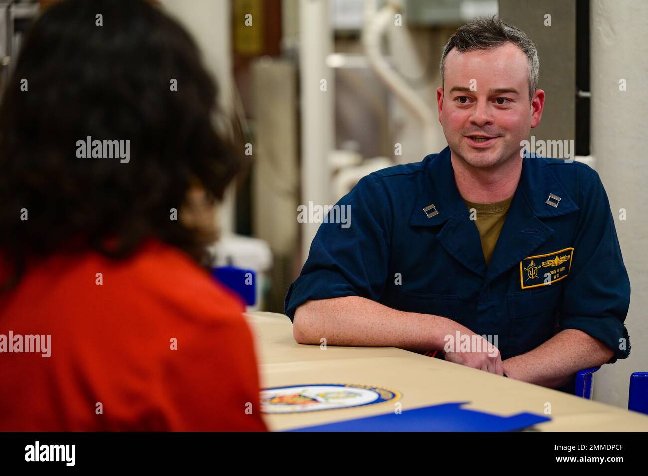 U.S. Navy Lt. John Gwin, right, an integrated air and missile defense ...