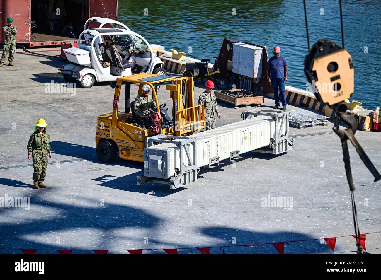 U.S. Sailors prepare an SM-2 Block IIIA missile to be loaded onto the ...