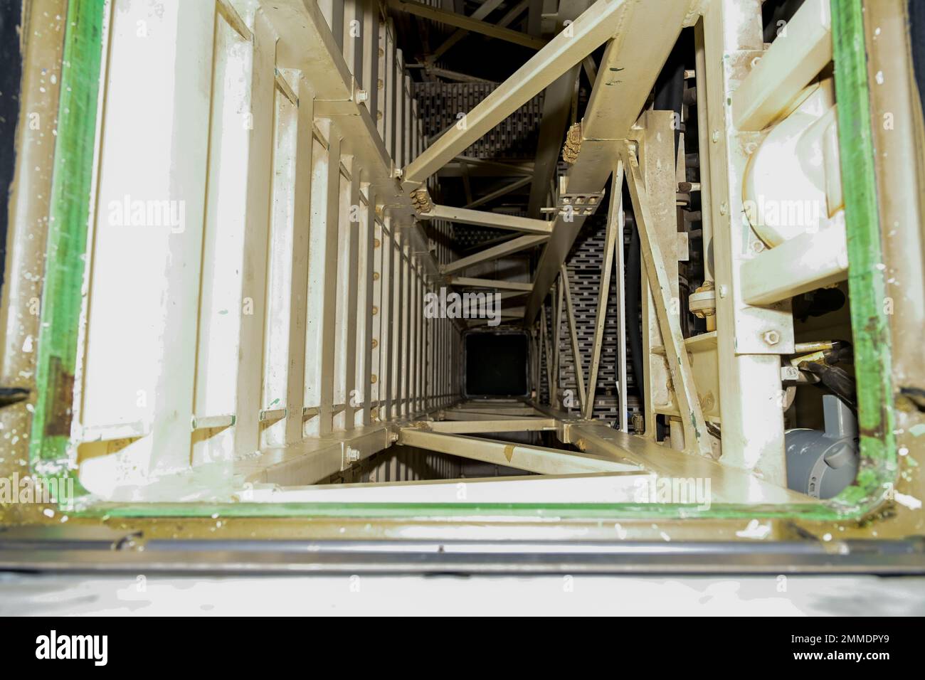 A vertical launching system cell is open on the Arleigh Burke-class ...