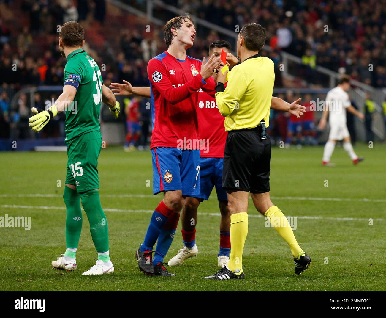 Referee Ovidiu Hategan show red card to CSKA goalkeeper Igor Akinfeev ...