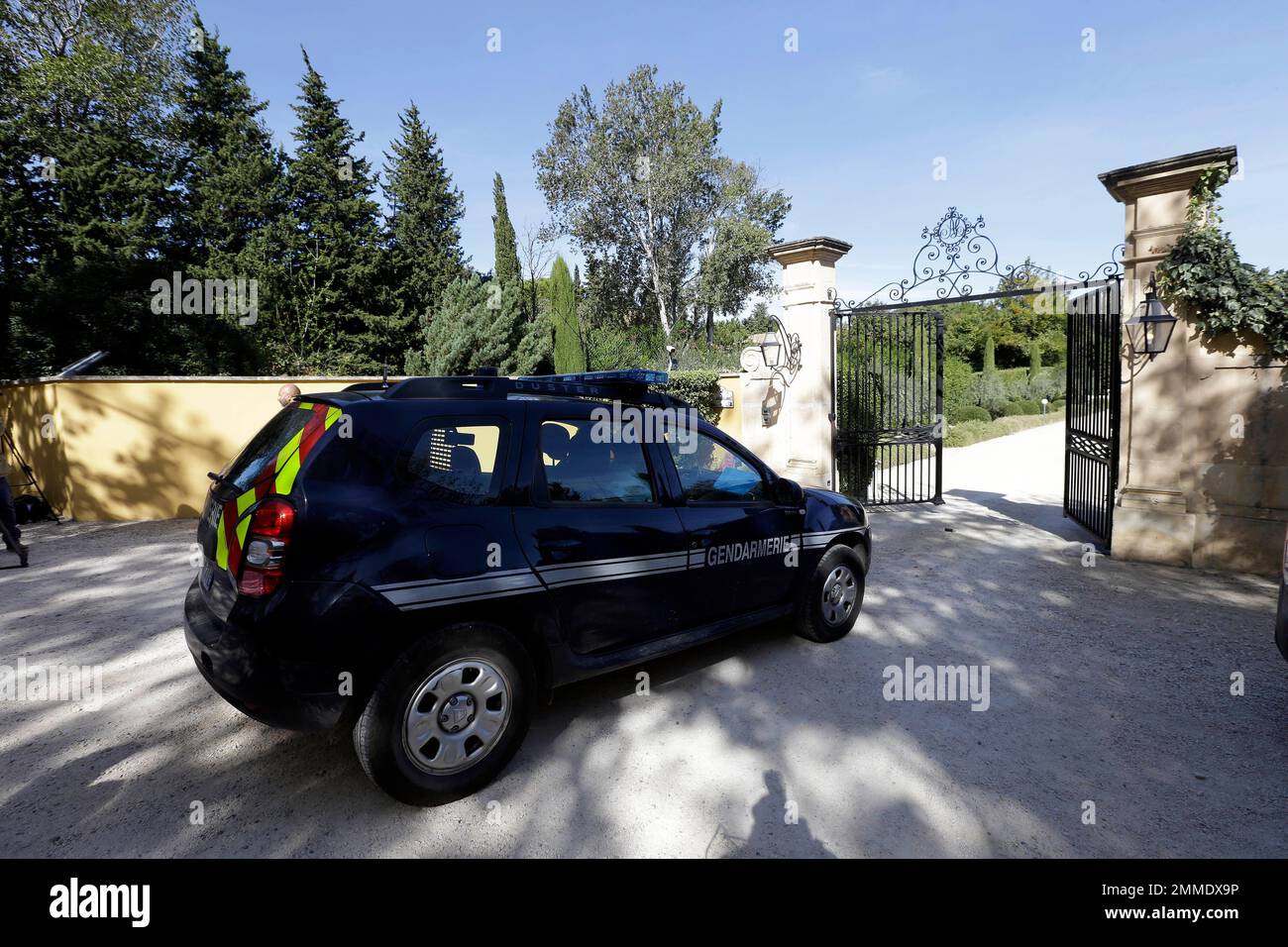 A car of the French gendarmes enters the gate to Charles Aznavour's ...