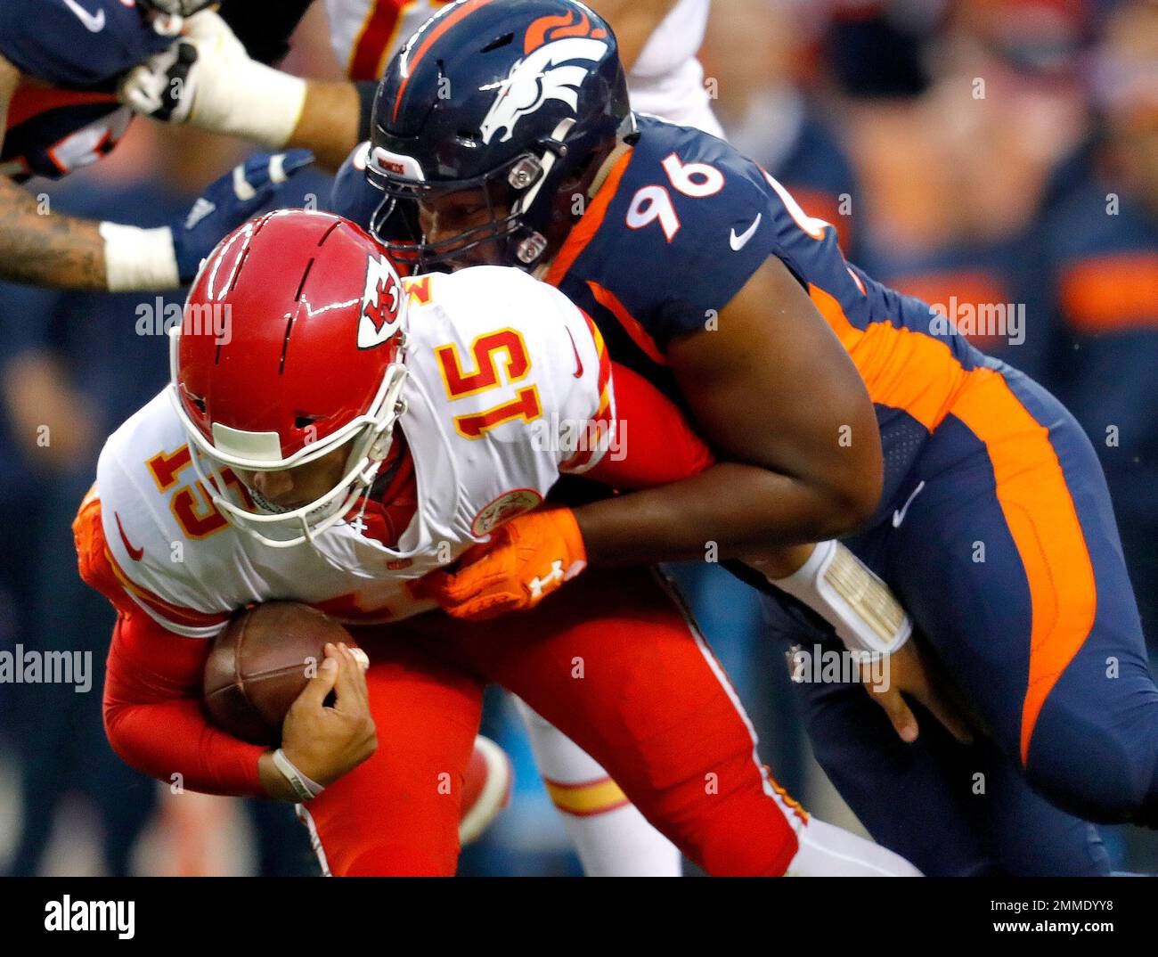 Kansas City Chiefs quarterback Patrick Mahomes (15) is tackled by ...