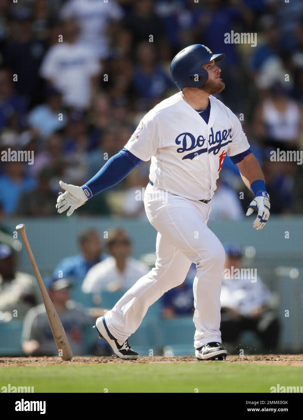 Los Angeles Dodgers' Max Muncy watches the flight of his two-run home ...
