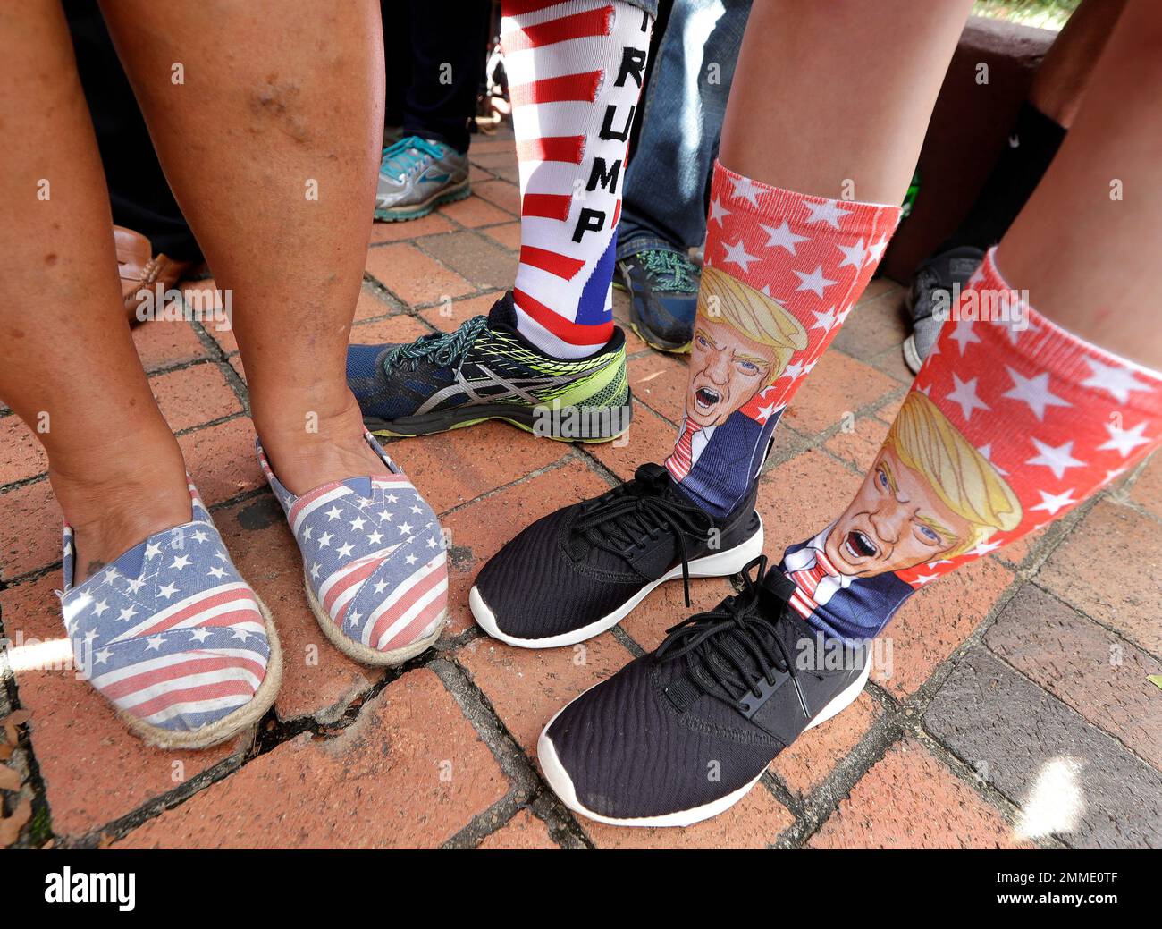 People wear President Donald Trump socks and patriotic shoes as they ...