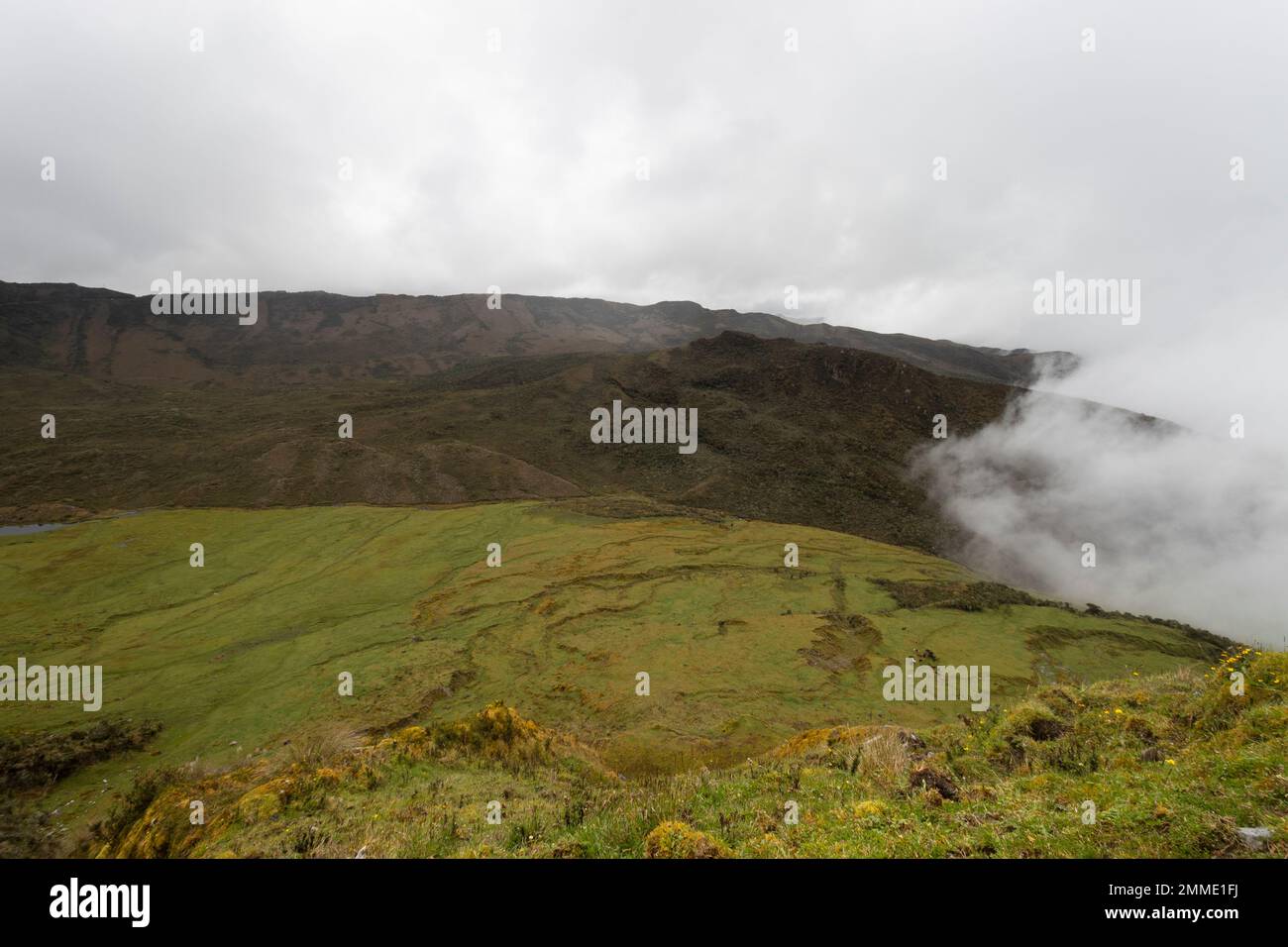 Beautiful colombian paramo valley landscape with green grass and clouds ...
