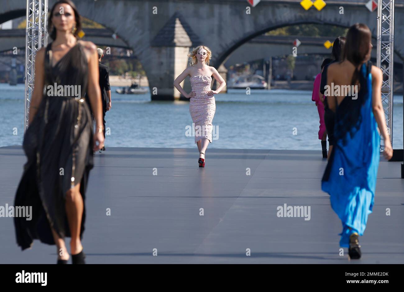 Actress Elle Fanning, center, models during L'Oreal show part of Spring ...