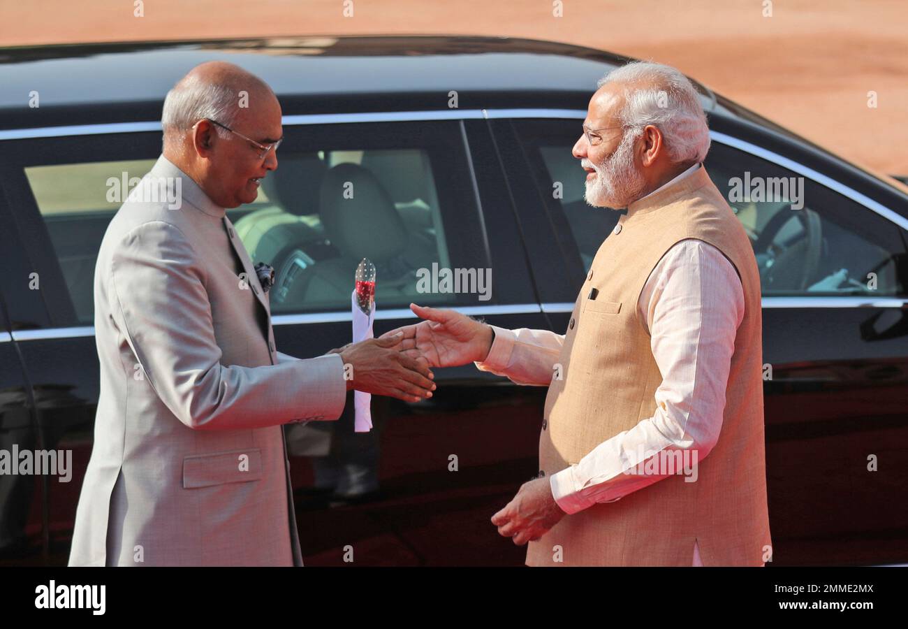 Indian Prime Minister Narendra Modi, right, wishes Indian President Ram ...