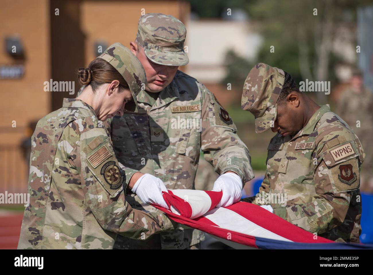 Liberty Wing Airmen conduct a flag folding during the closing ceremony ...