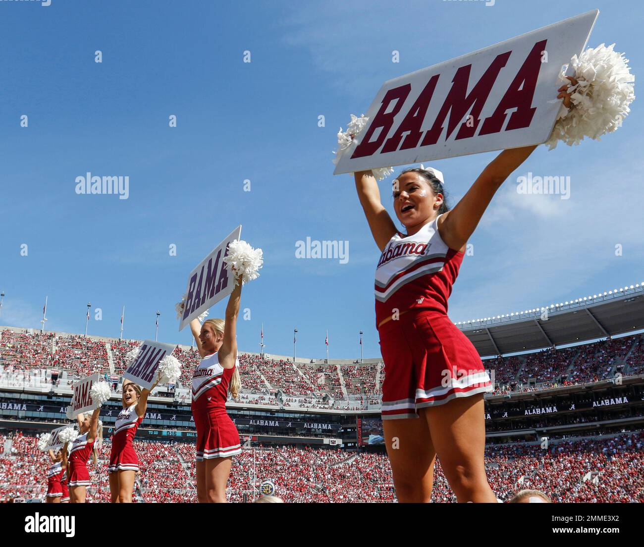 Alabama cheerleaders lead fans in a cheer before the first half of an ...