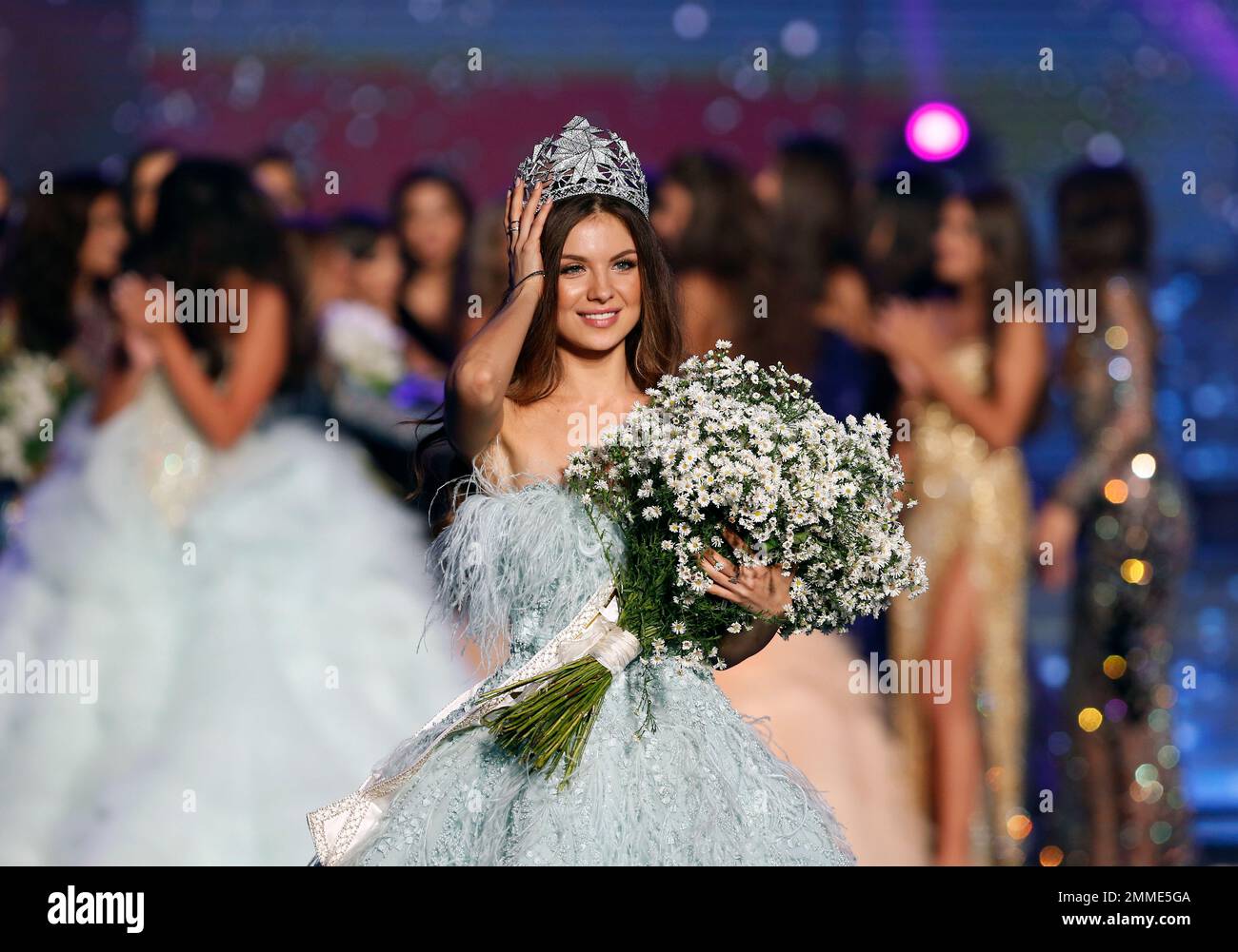 Lebanese Maya Reaidy, newly crowned Miss Lebanon, fixes her crown after ...