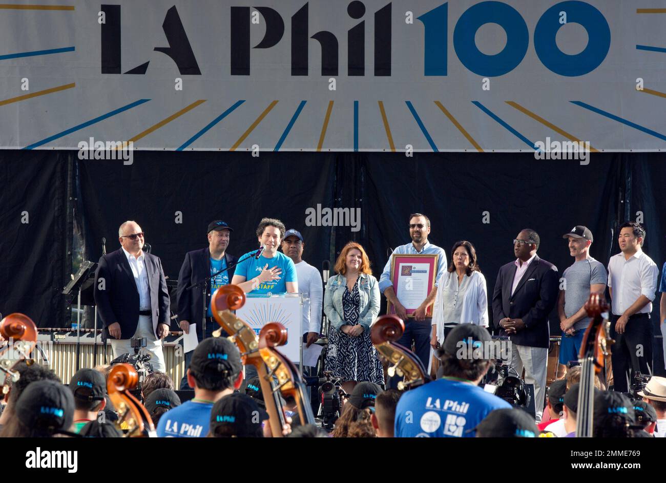 Los Angeles Phil Music & Artistic Director Gustavo Dudamel, third from ...