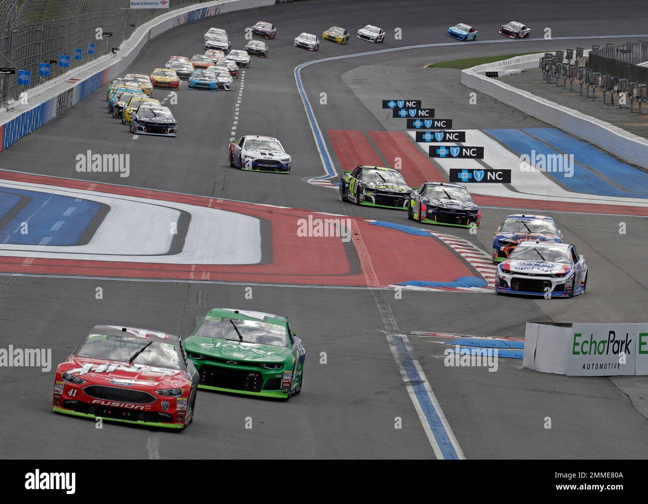 Kurt Busch (41) leads the field through a chicane on the first lap of ...