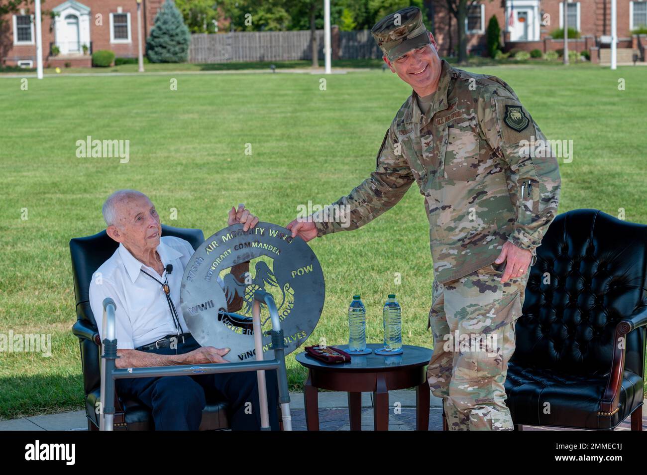 Wilbert “Vince” Rolves accepts a token of appreciation from Col. Chris ...