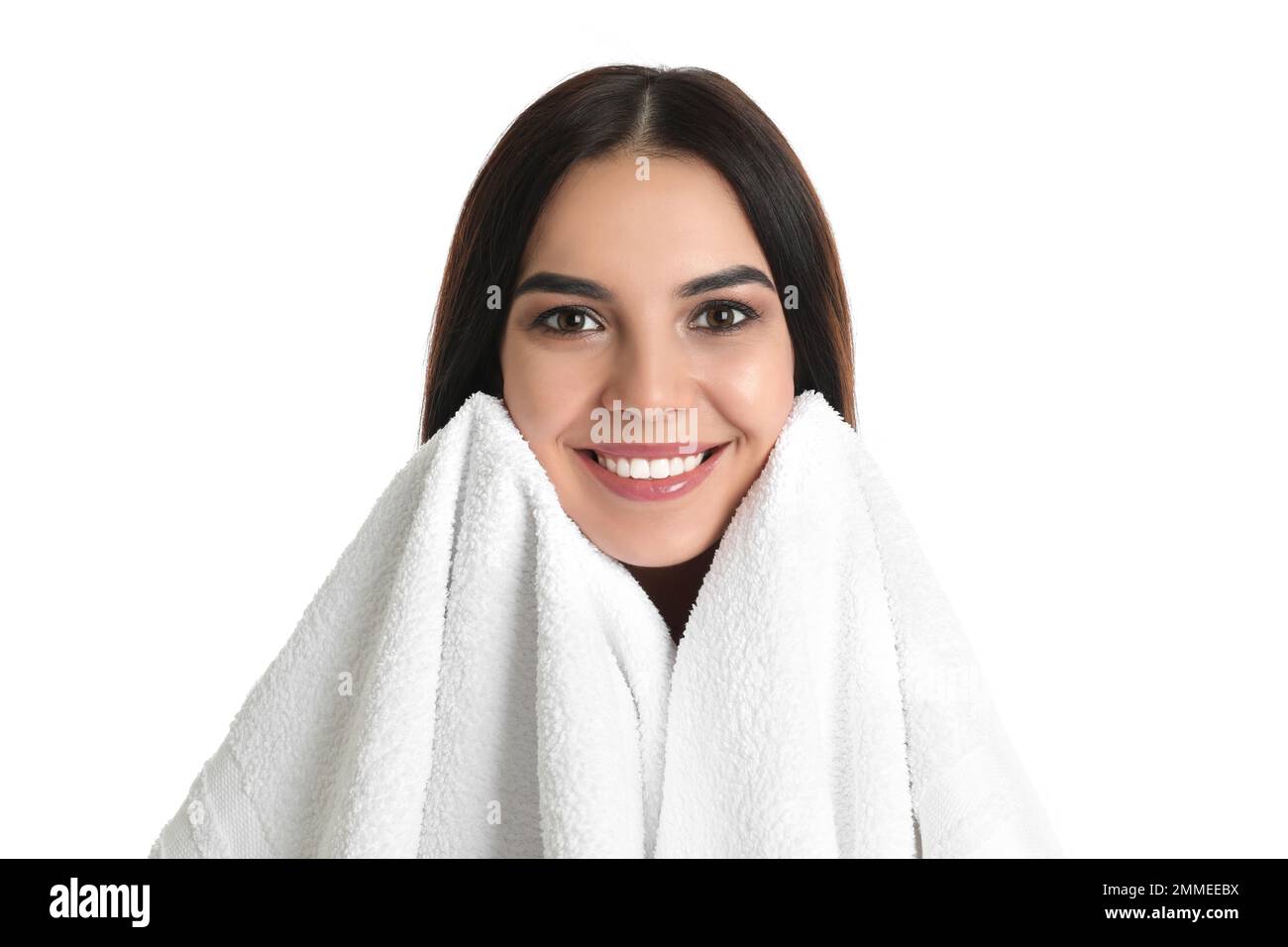 Young woman wiping face with towel on white background Stock Photo - Alamy