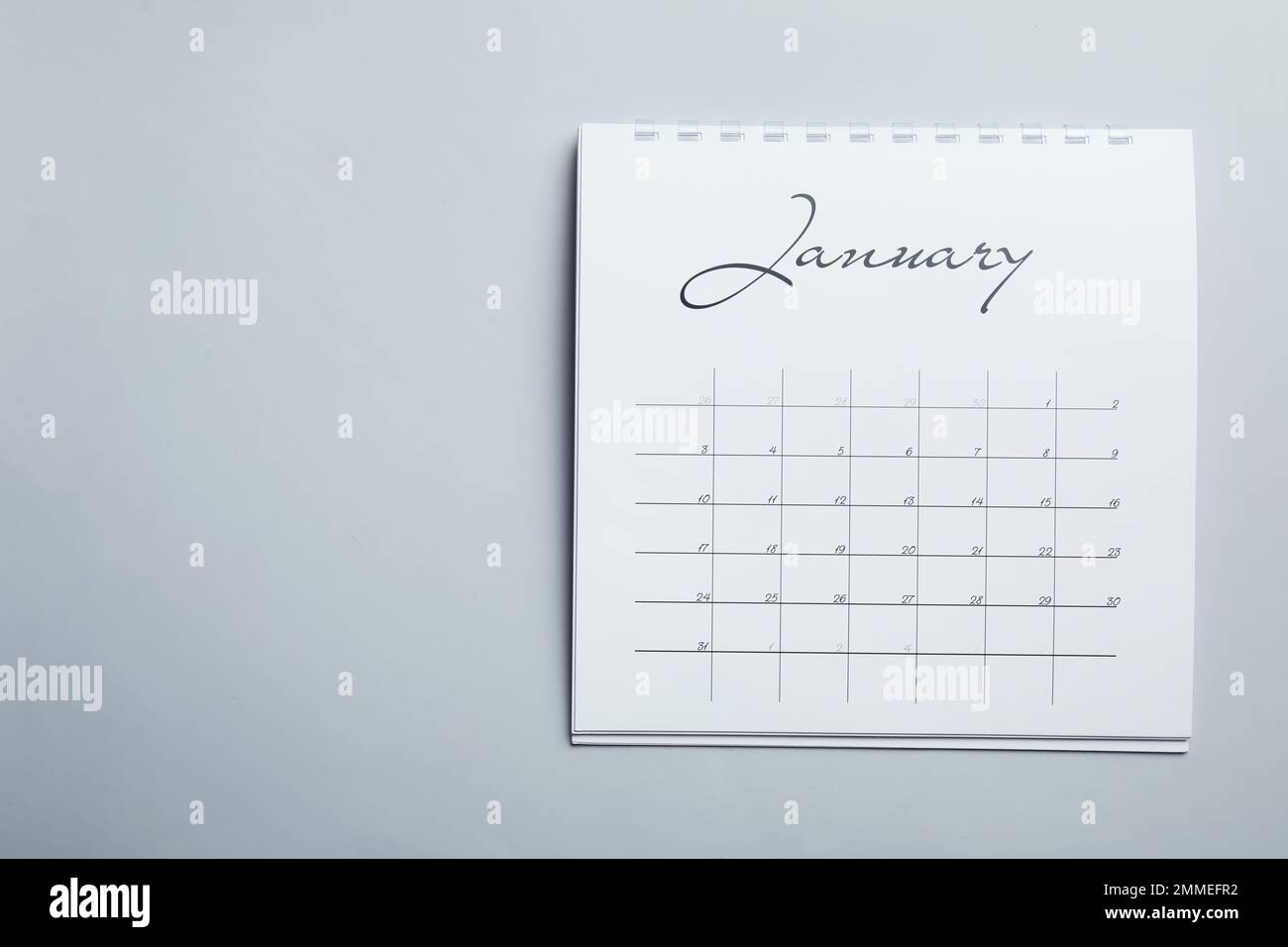 January calendar on light grey background, top view. Space for text ...