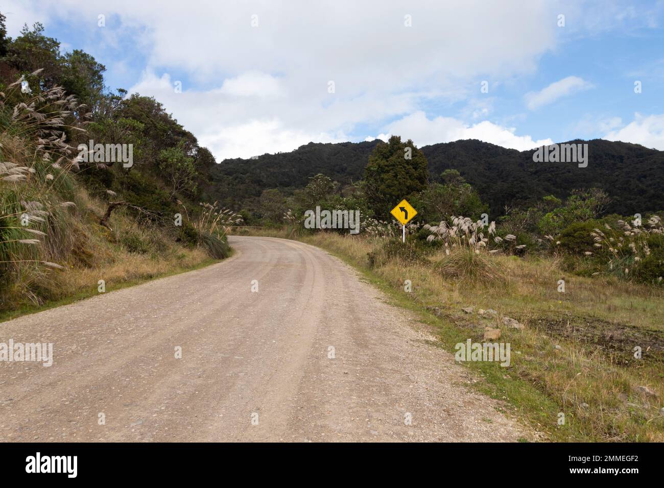 CHINGAZA, COLOMBIA - Countryside sand road with left traffic signal in ...