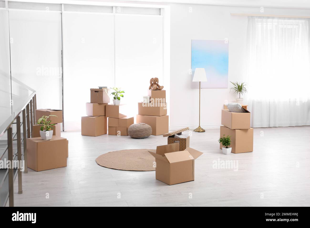 Room interior with moving boxes and belongings Stock Photo - Alamy