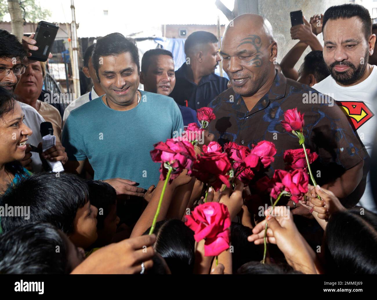 Former world heavyweight boxing champion Mike Tyson receives flowers ...