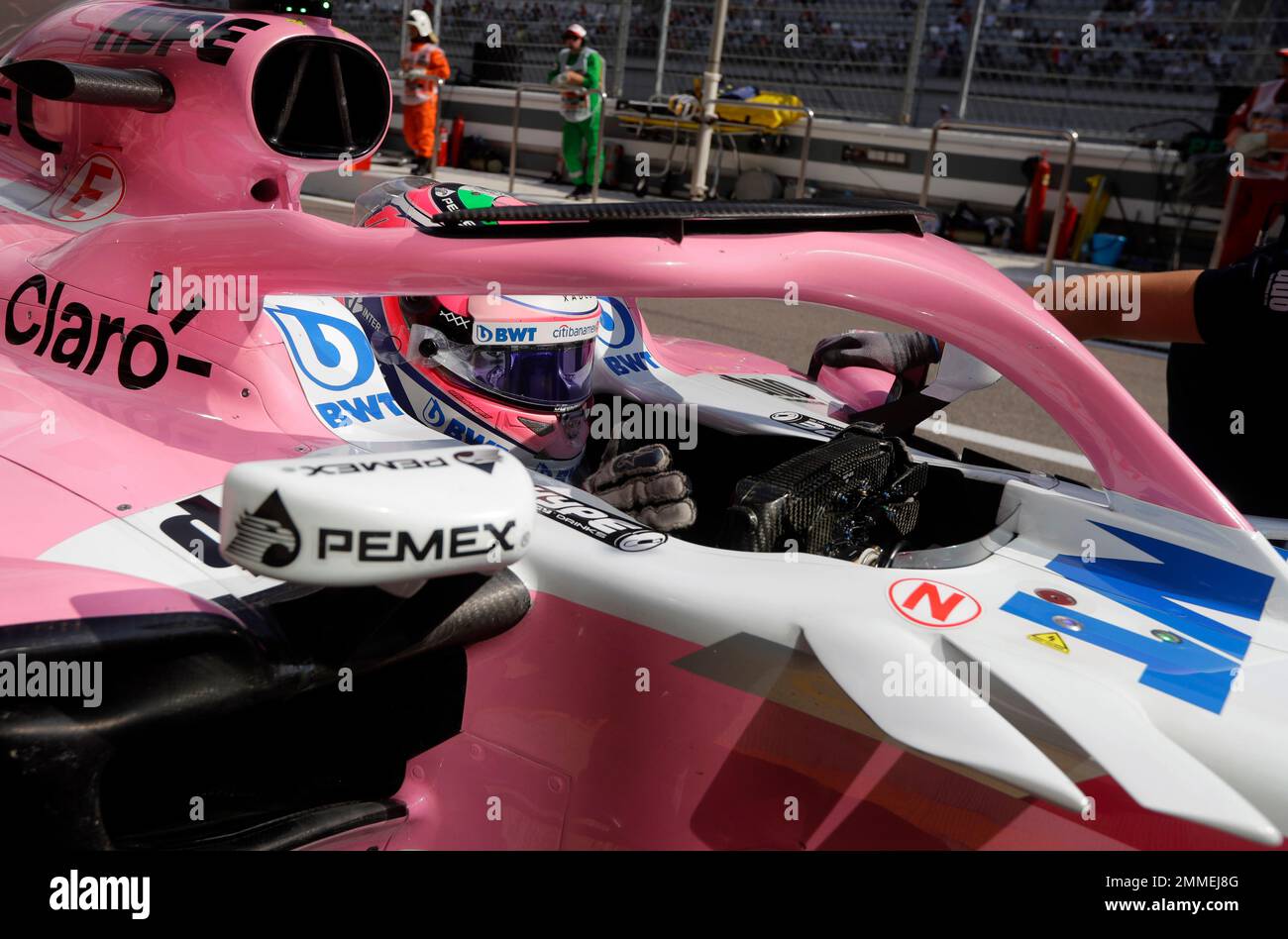 Force India driver Sergio Perez of Mexico gestures in his car during ...