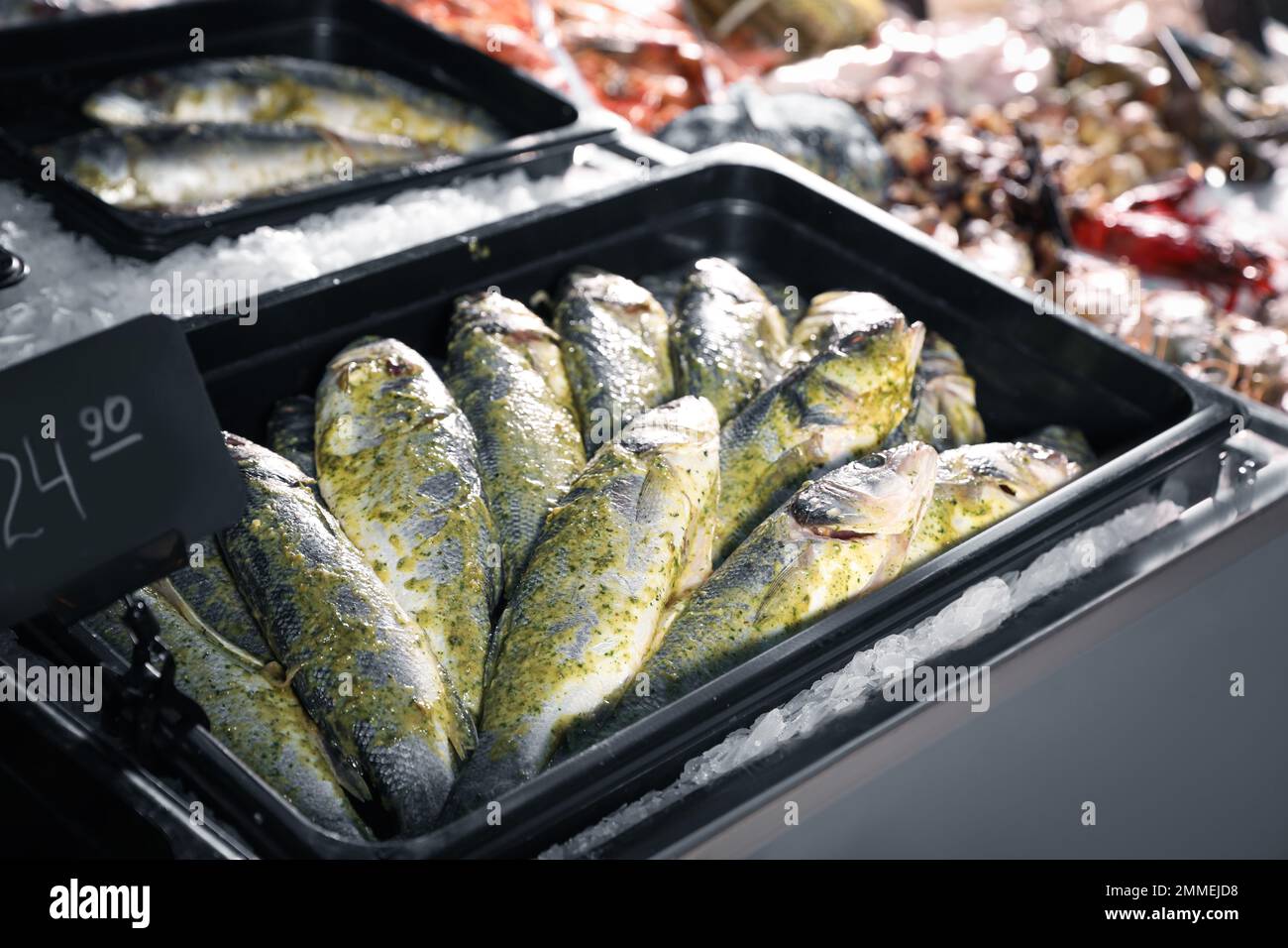 Fresh marinated fish in container on display, closeup Stock Photo - Alamy