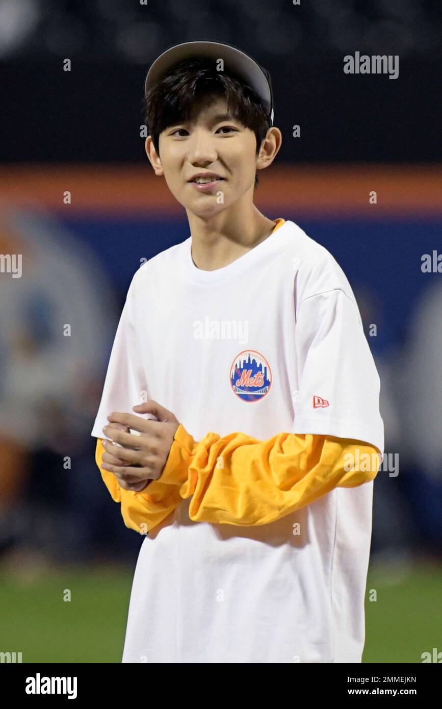 Chinese musician and actor Roy Wang prepares to throw out the first ...