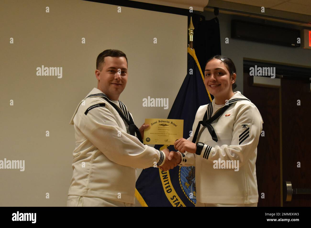 U.S. Navy FTSN Casey Lopez receives her certificate of completion for ...