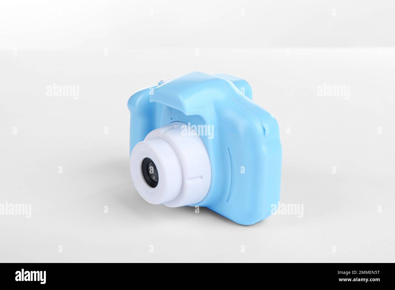 Light blue toy camera isolated on white Stock Photo - Alamy