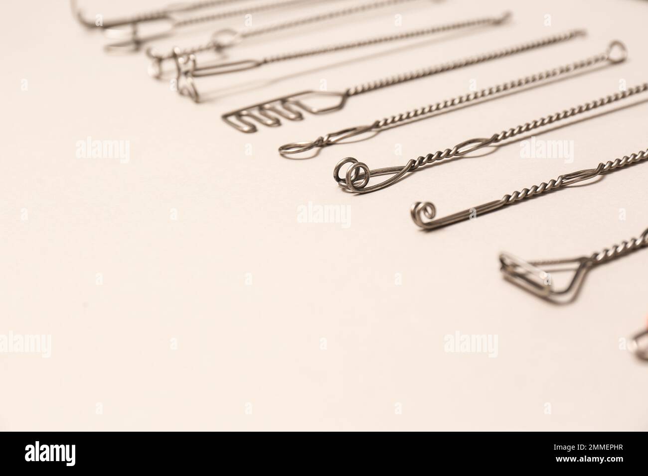 Set of logopedic probes for speech therapy on beige background. Space ...