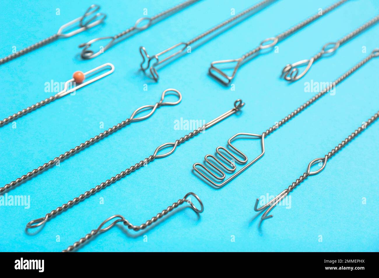 Set of logopedic probes for speech therapy on light blue background ...