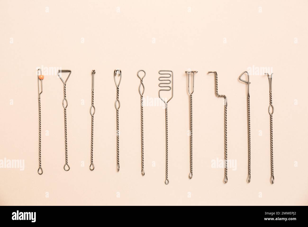 Set of logopedic probes for speech therapy on beige background, flat ...