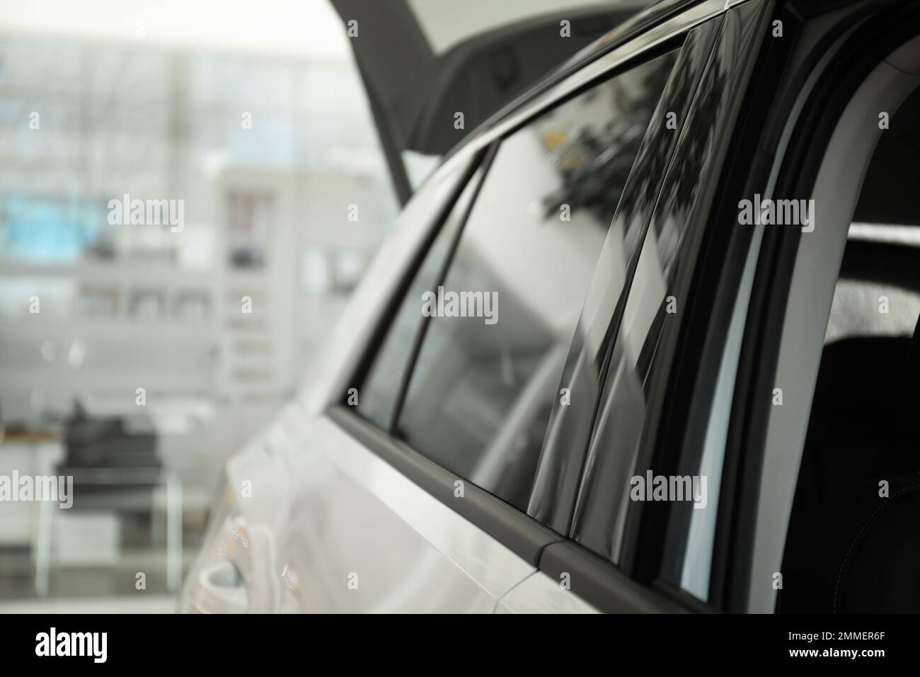 Modern car with tinting foil on window, closeup Stock Photo - Alamy