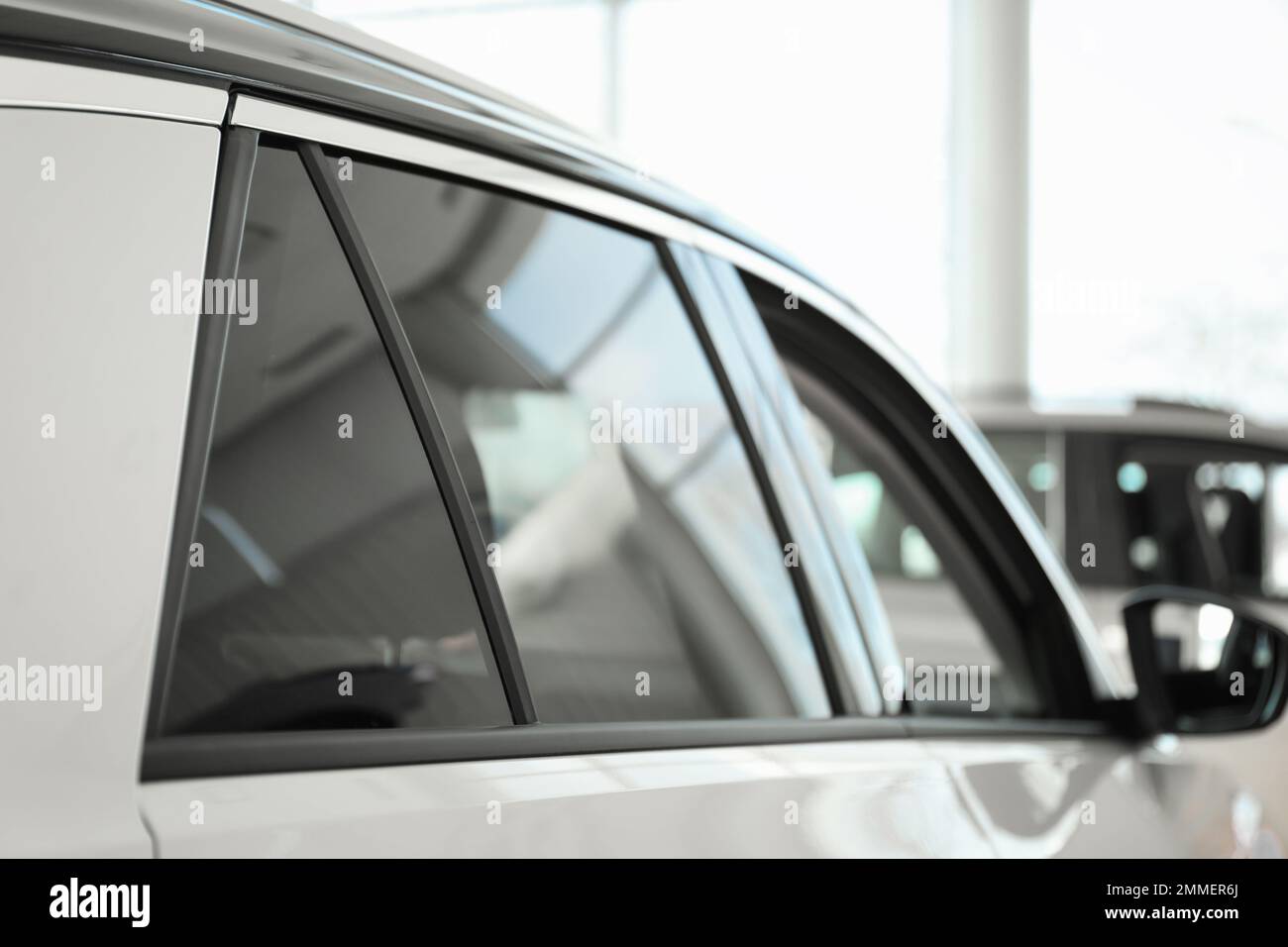 Modern car with tinting foil on window, closeup Stock Photo - Alamy