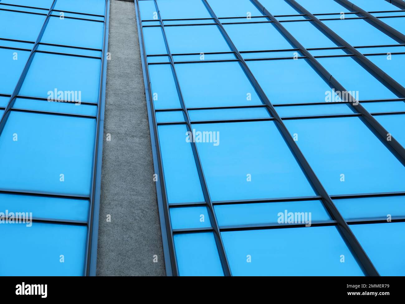 Modern building with tinted windows, low angle view Stock Photo - Alamy