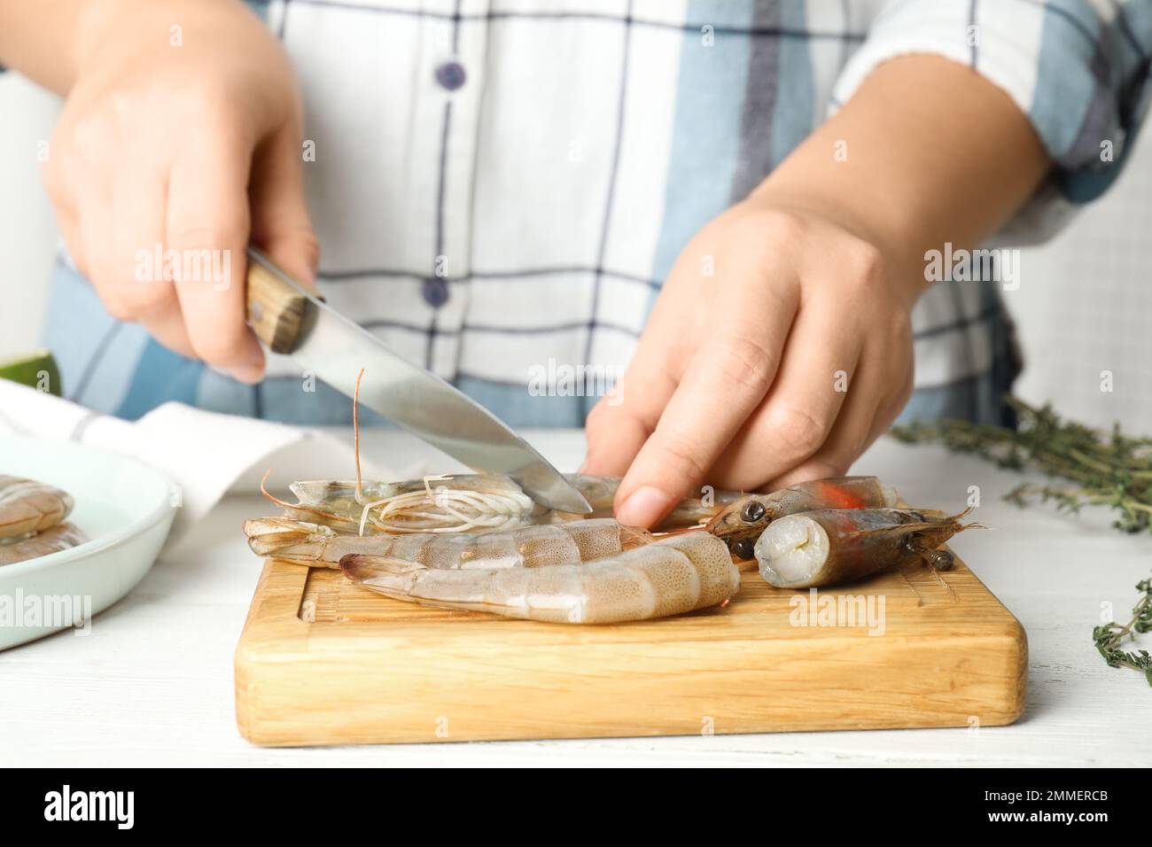 Woman cutting fresh shrimp hi-res stock photography and images - Alamy