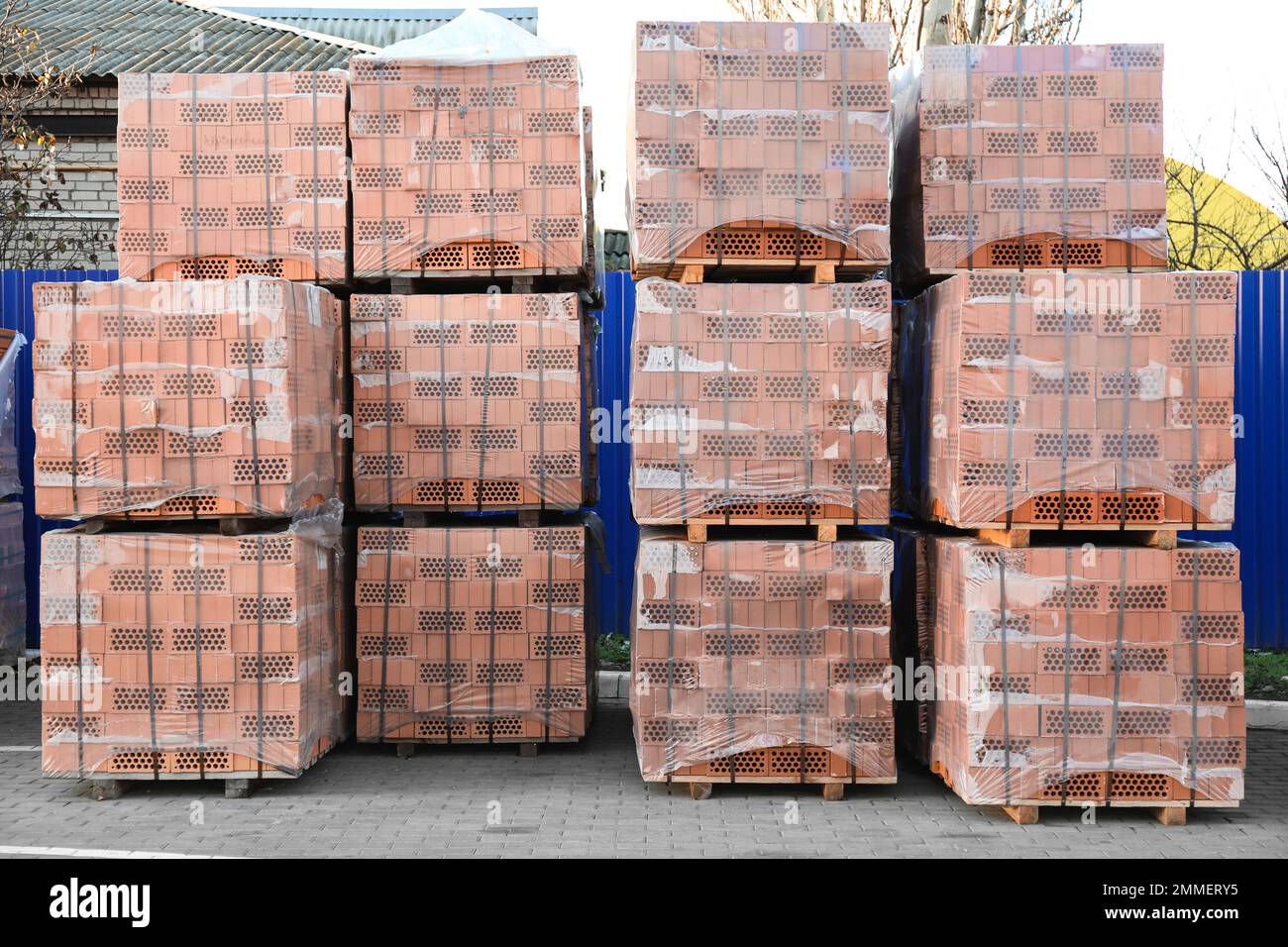 Pallets with red bricks outdoors. Building materials wholesale Stock ...