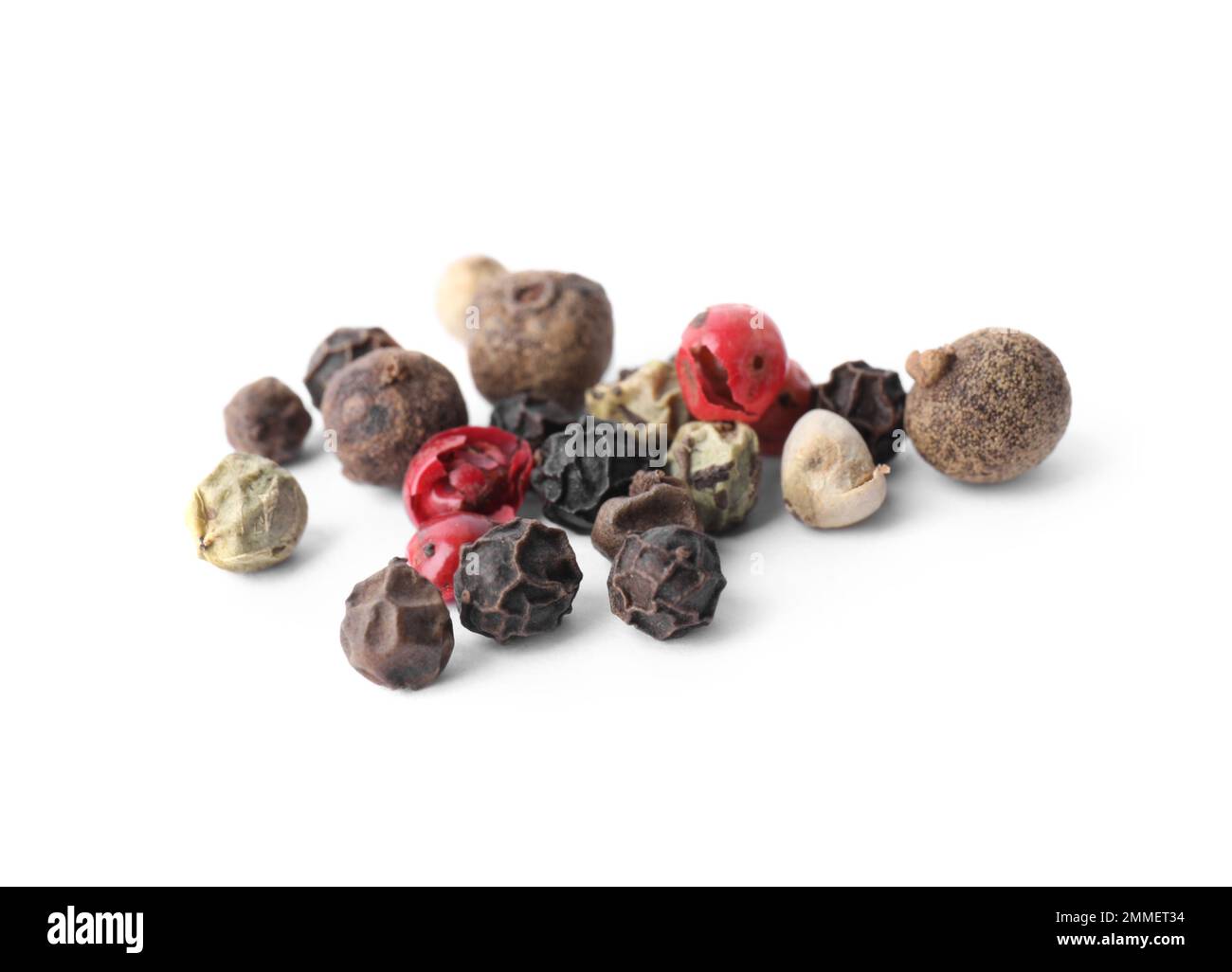 Mix of different pepper grains isolated on white Stock Photo - Alamy