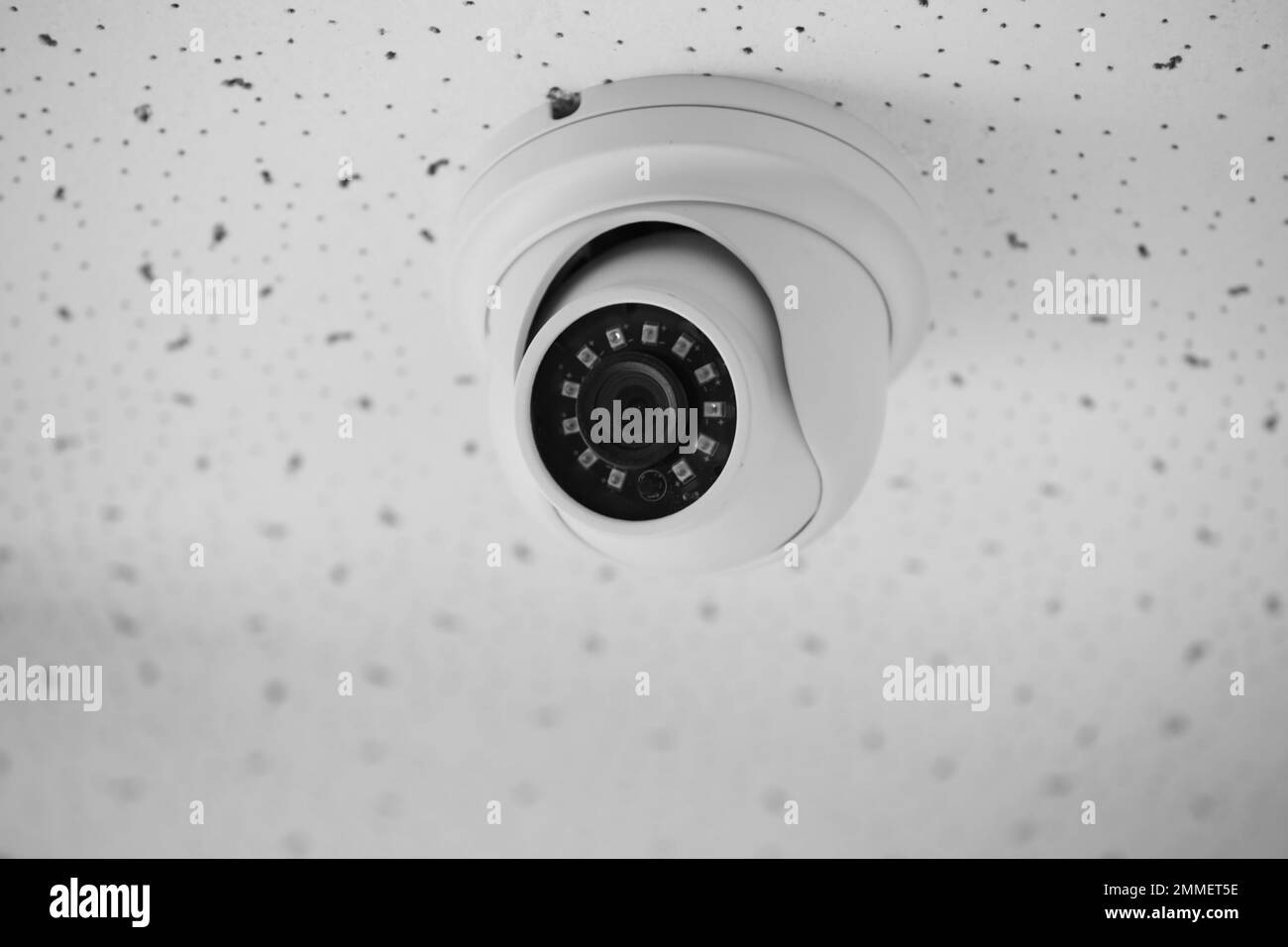Modern CCTV camera on ceiling indoors, closeup Stock Photo - Alamy