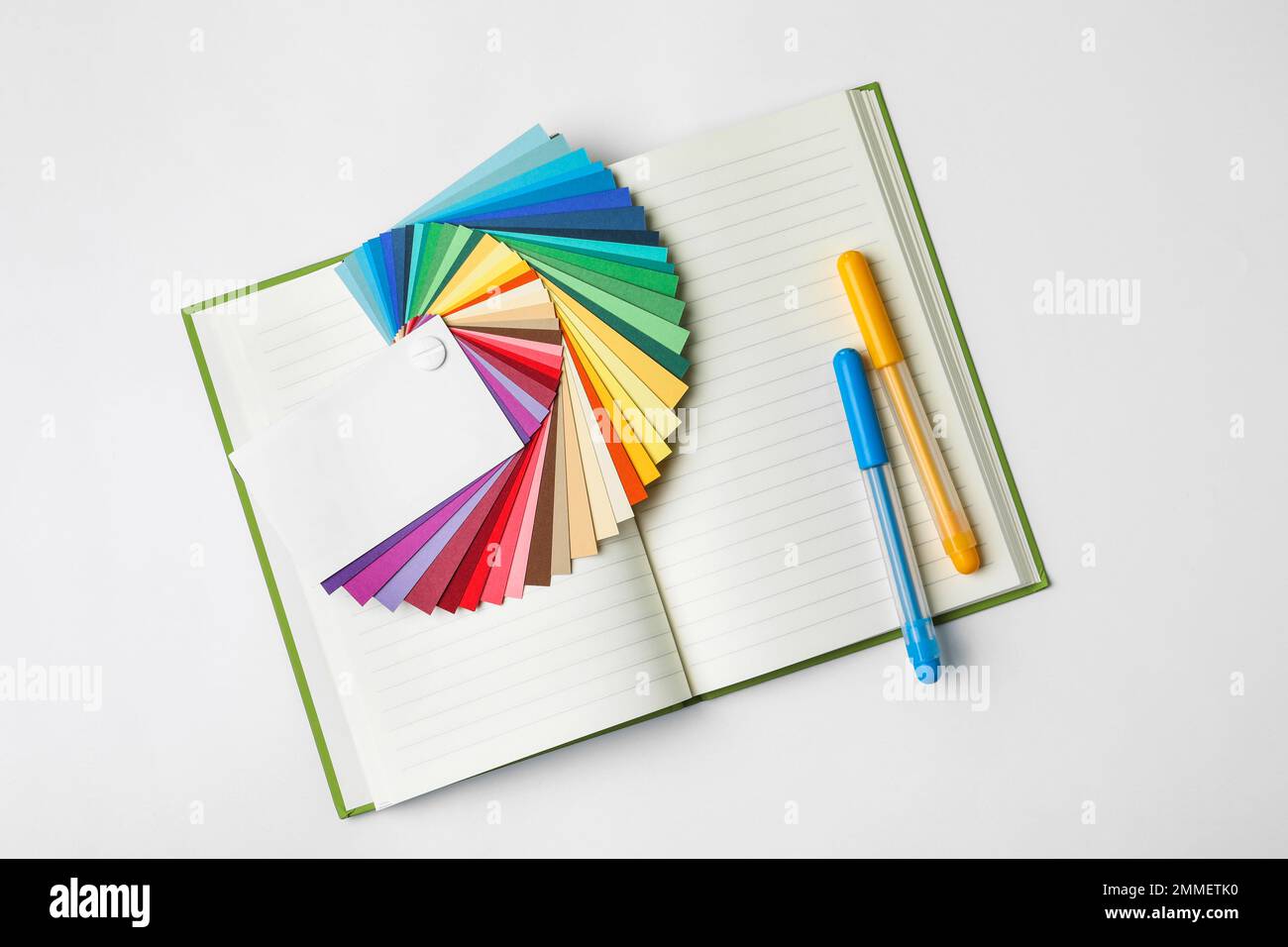 Color palette, pens and notebook on white background, top view Stock ...