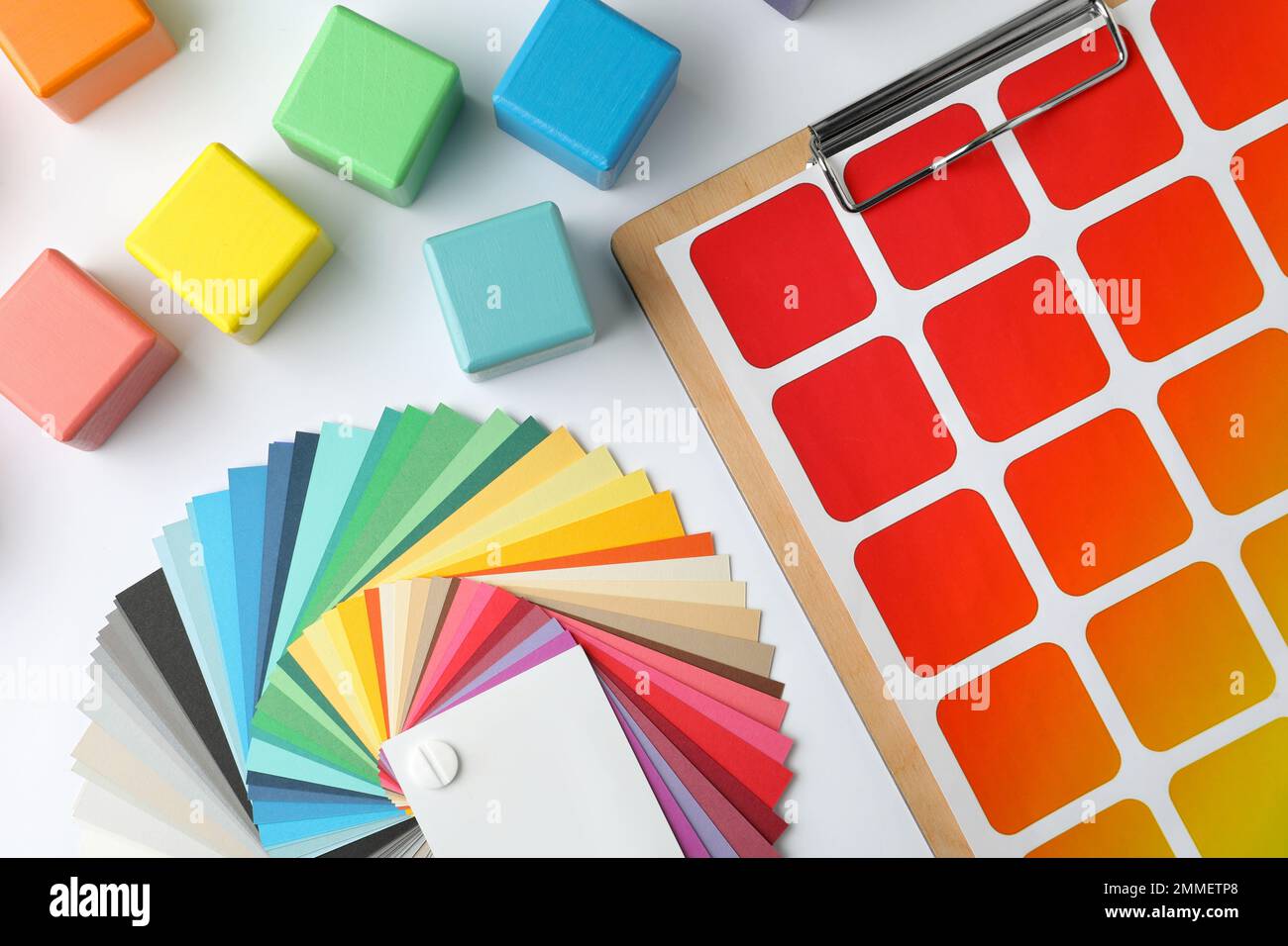 Color palettes and cubes on white background, top view Stock Photo - Alamy