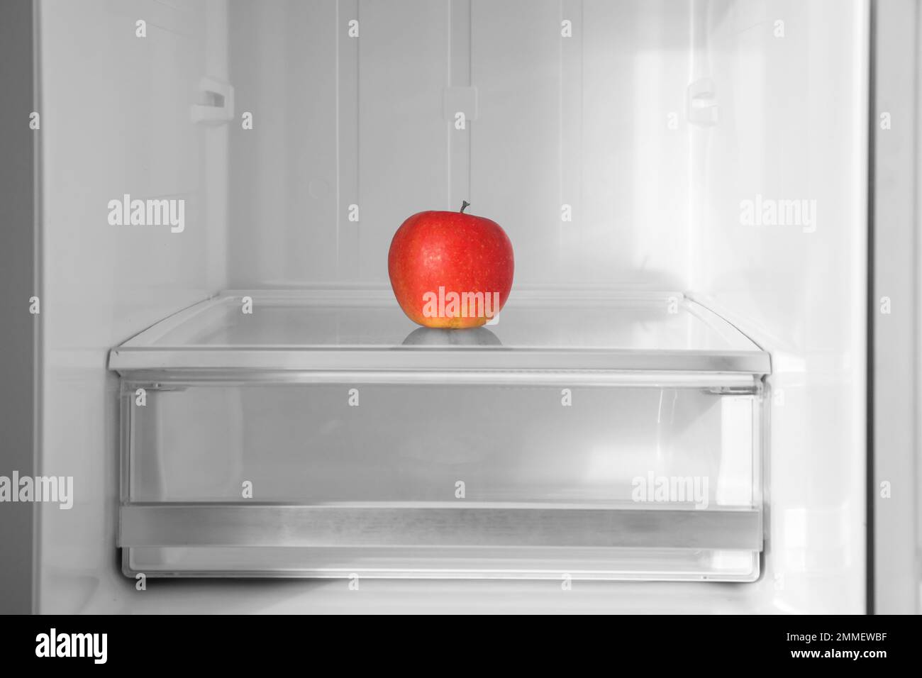 Red apple on shelf inside modern refrigerator Stock Photo - Alamy
