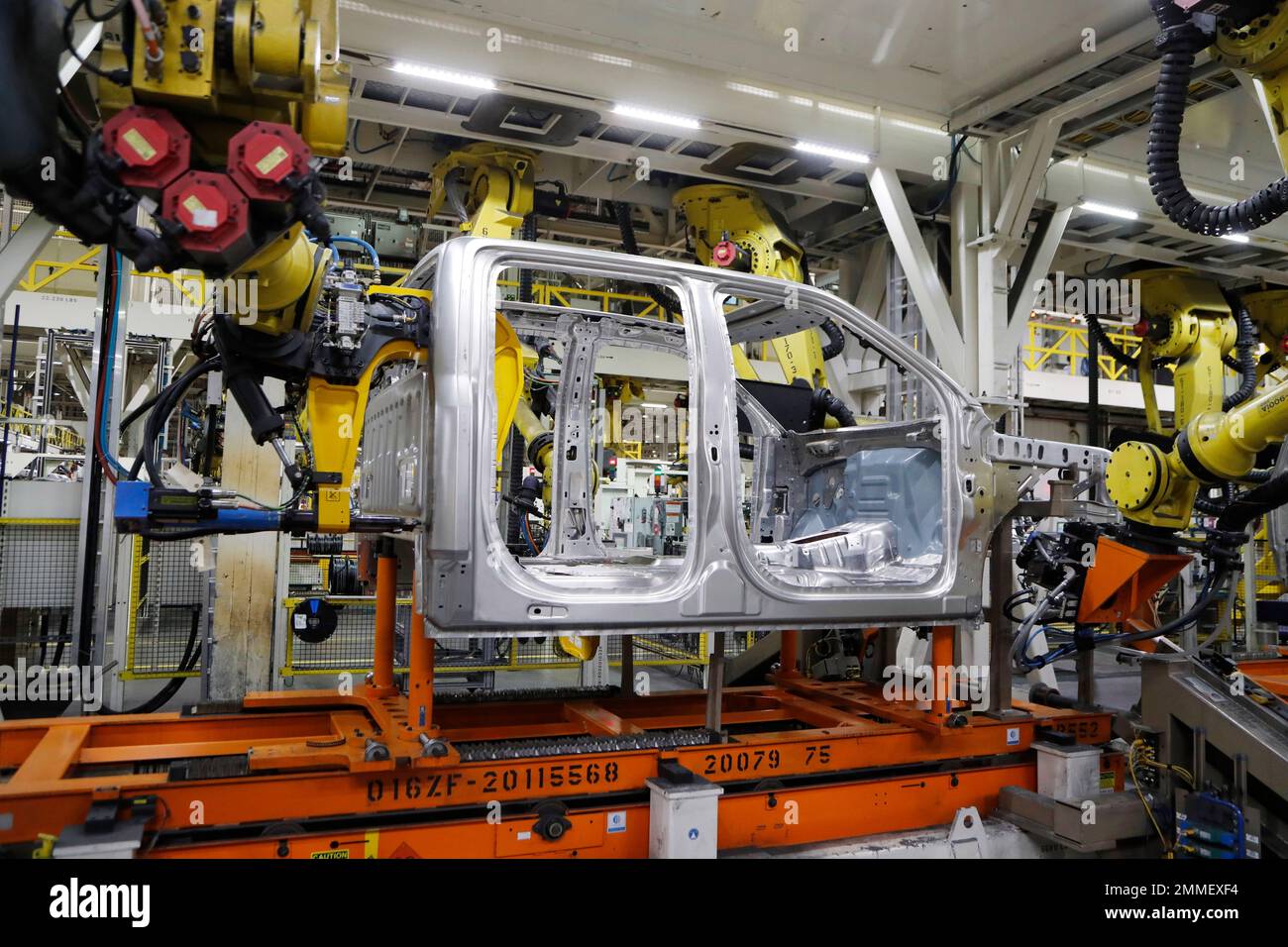 Robots weld the cab of a 2018 Ford F-150 truck on the assembly line at ...
