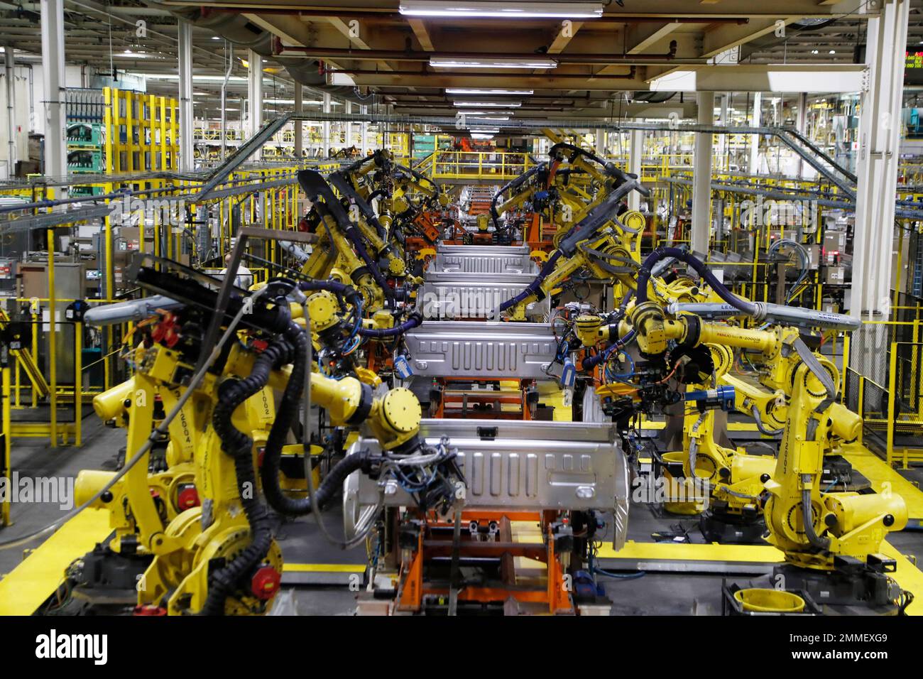Robots weld the bed of a 2018 Ford F-150 truck on the assembly line at ...