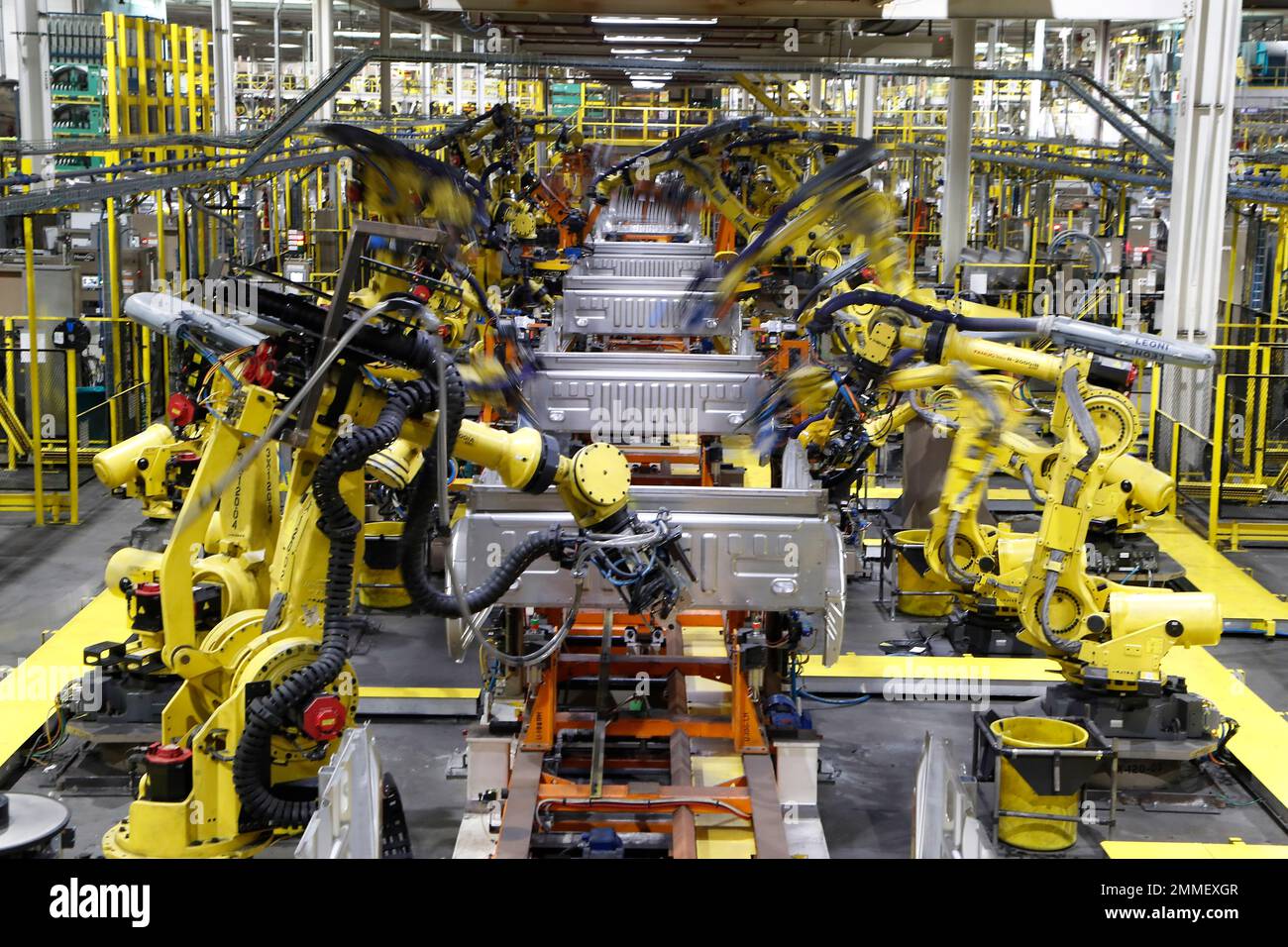 Robots weld the bed of a 2018 Ford F-150 truck on the assembly line at ...