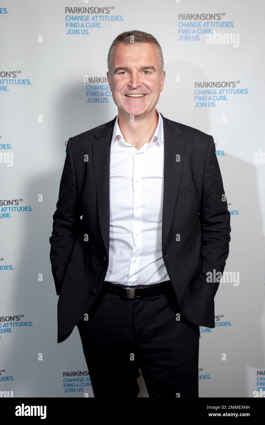 Dave Clark poses for photographers upon arrival for the Parkinson's UK ...