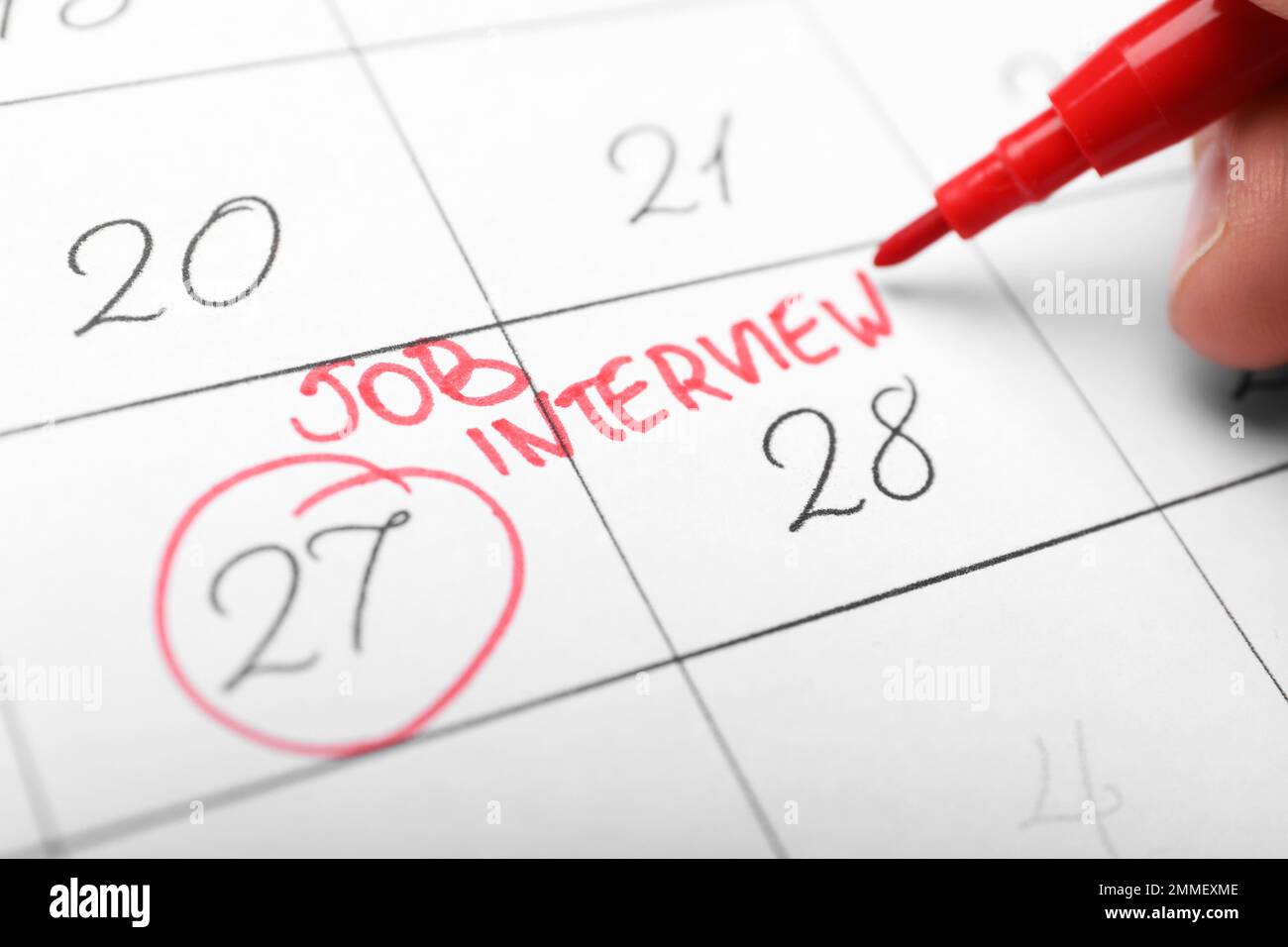 Woman marking date of job interview in calendar, closeup Stock Photo ...