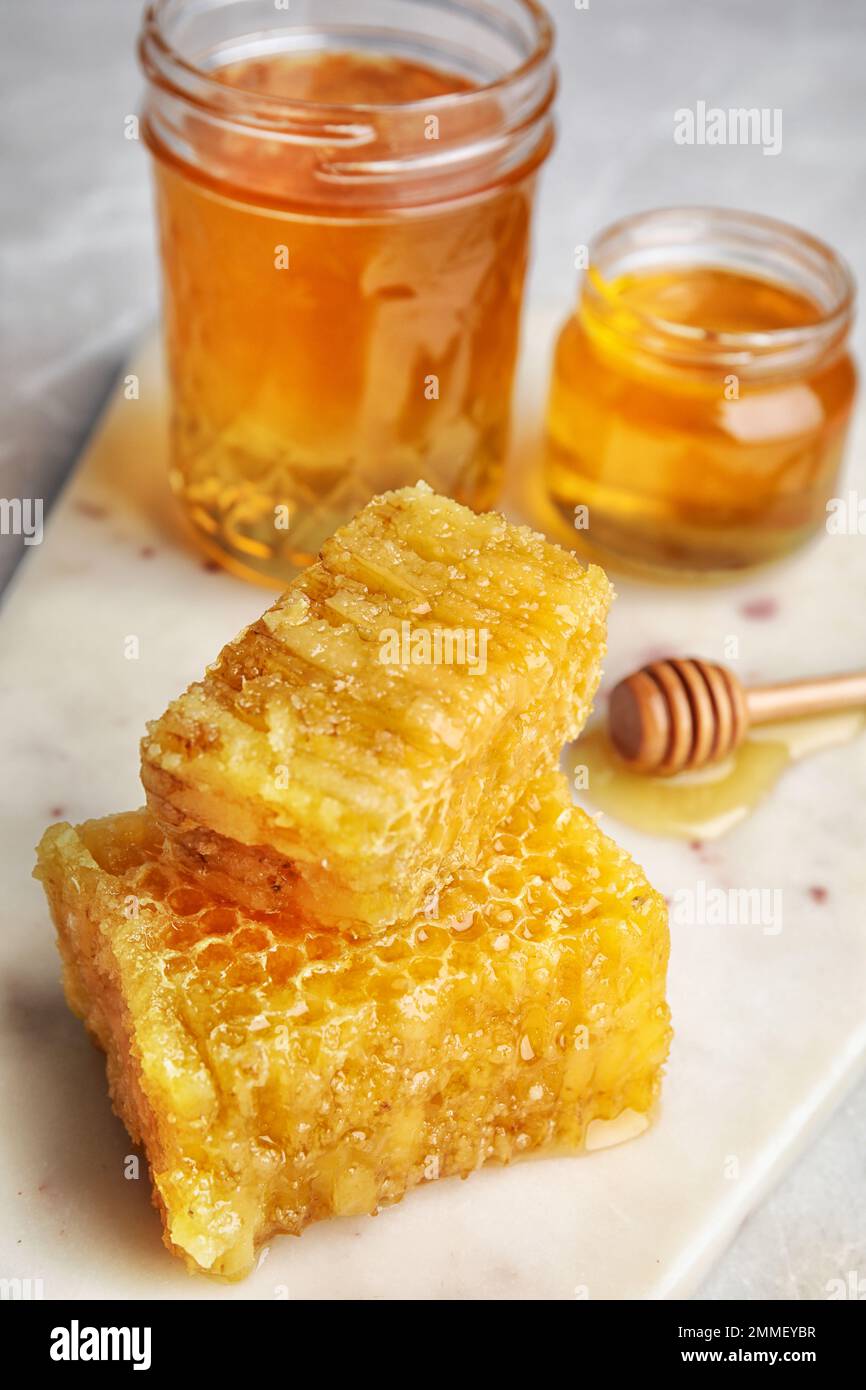 Composition with fresh honey on white board, closeup Stock Photo - Alamy