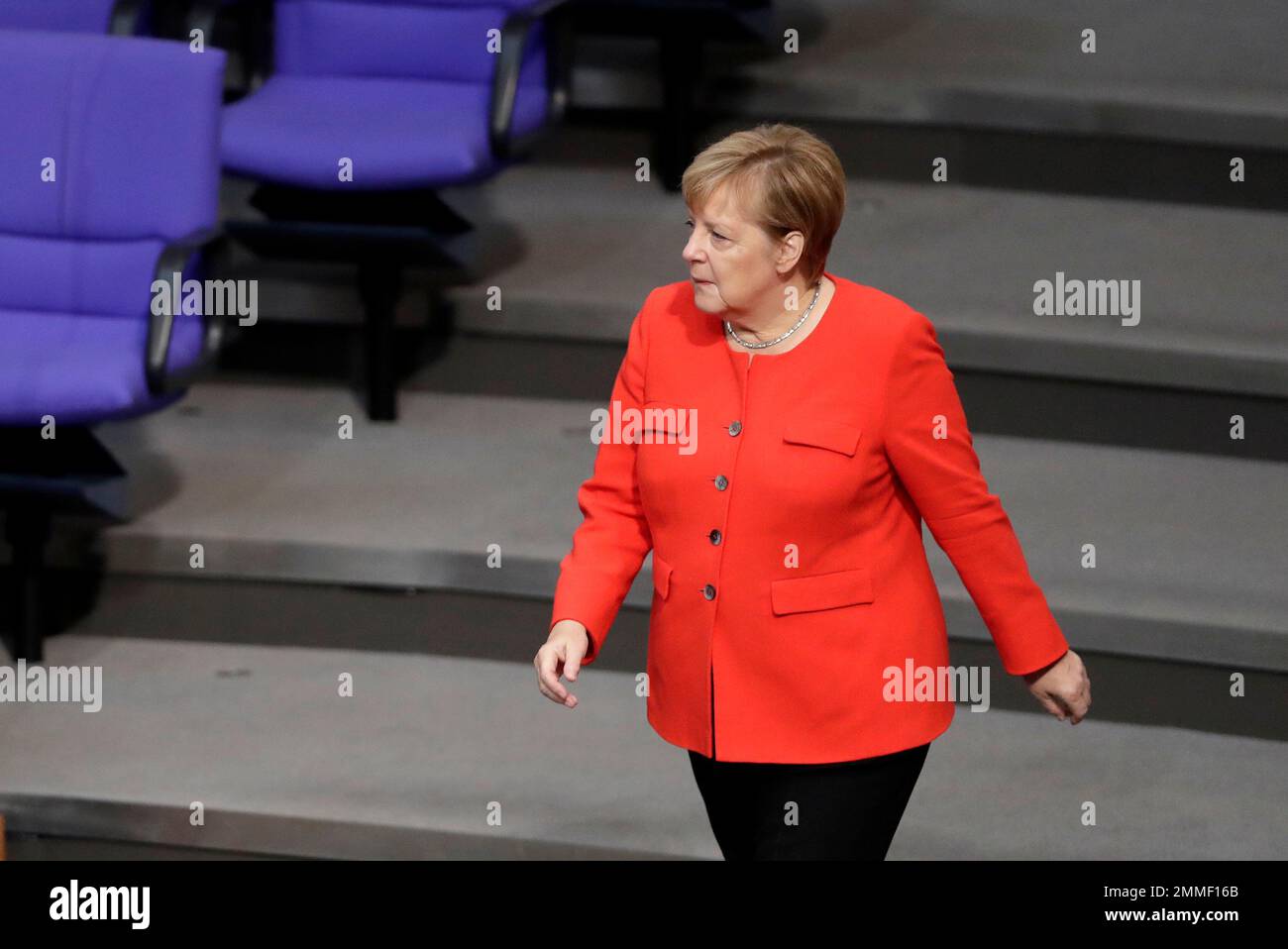 German Chancellor Angela Merkel enters the plenary hall during a ...