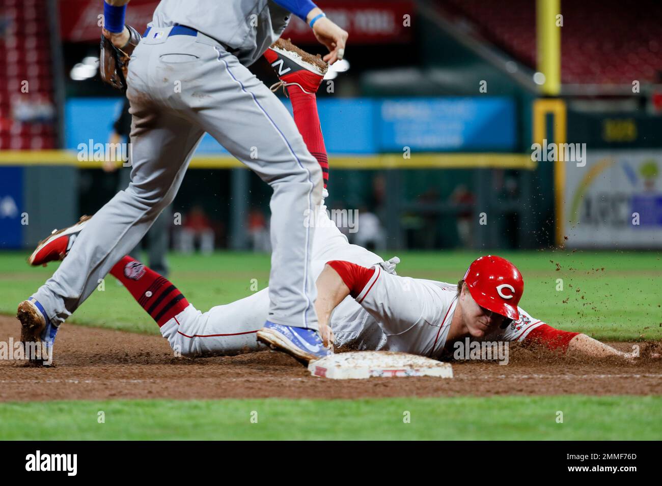 Cincinnati Reds' Brandon Dixon, right, is forced out at third by Kansas ...